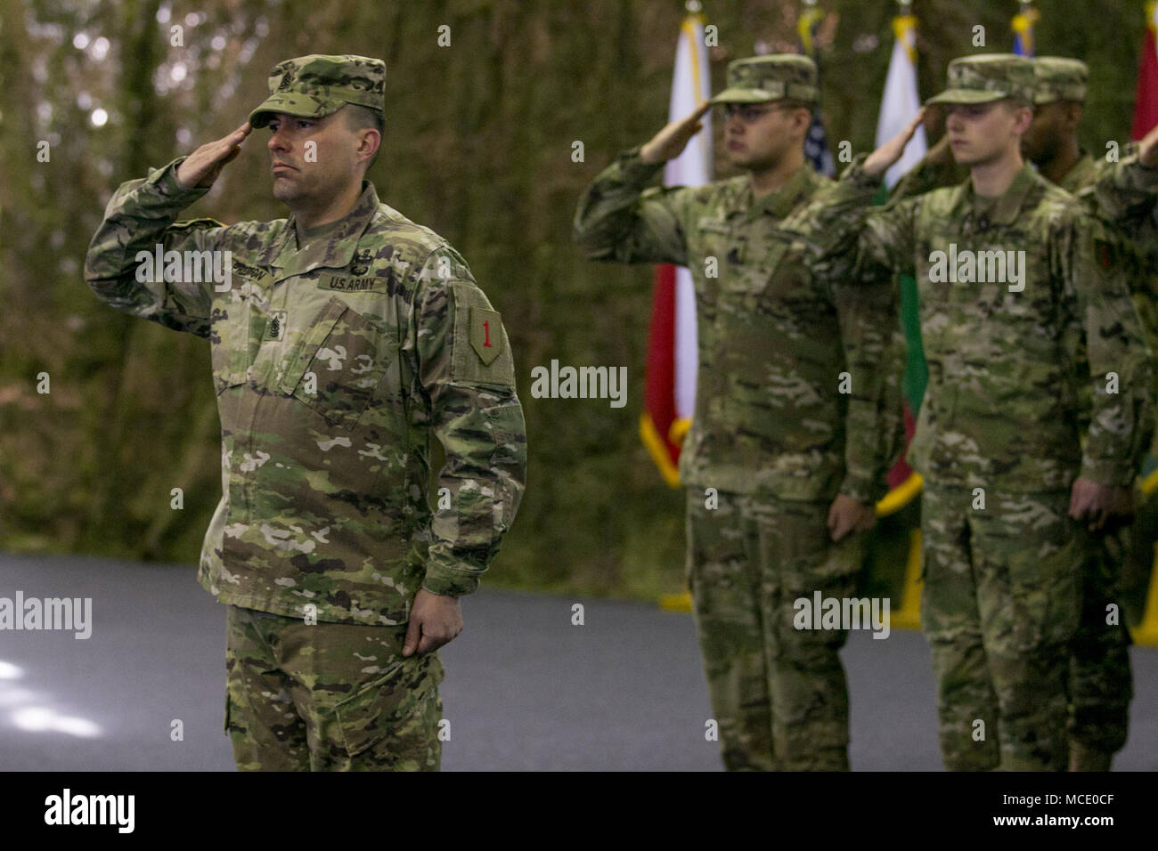 Sgt. Maj. Terry W. Preston, salutes with a formation of 1st Infantry ...