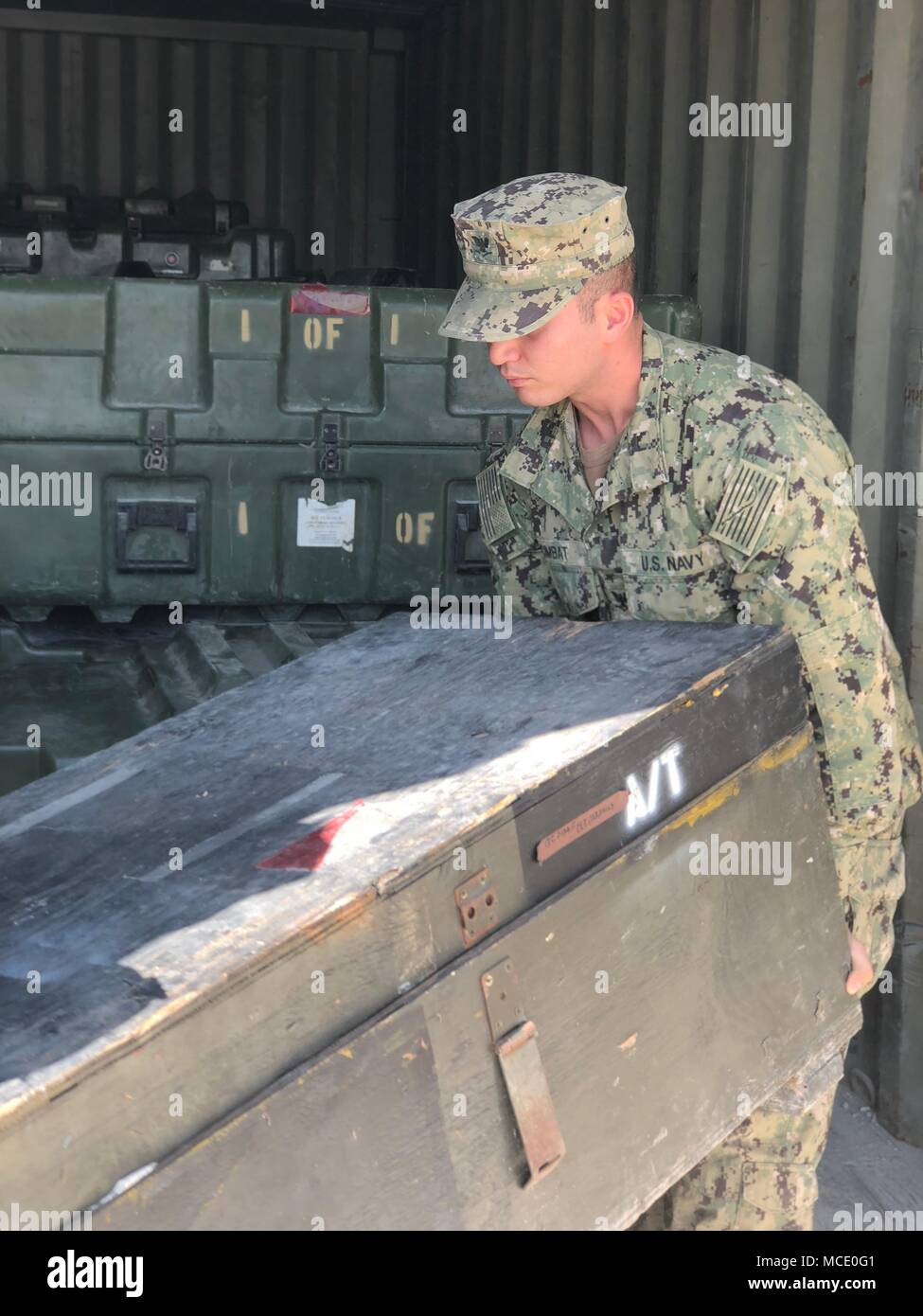 Construction Electrician 3rd Class Enes Cimbat, a Seabee assigned to ...