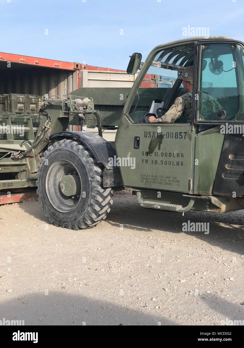 Equipment Operator 2nd Class Anthony Phillips, a Seabee assigned to ...