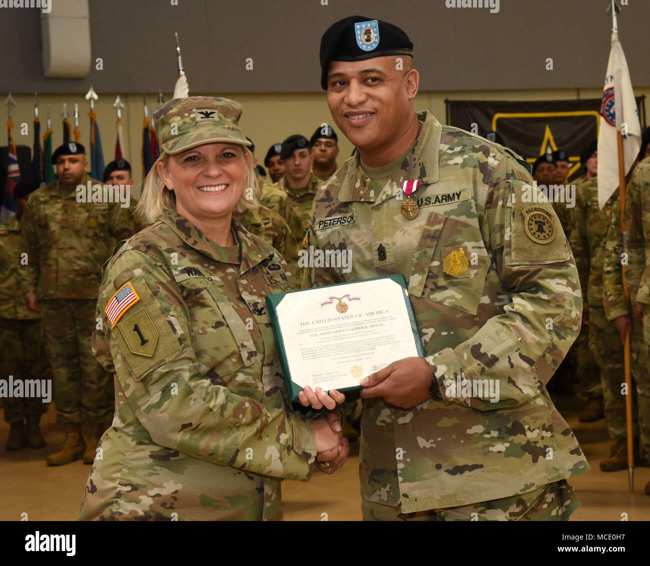 COL Dina S. Wandler and CSM Charles J. Peterson II pose for pictures ...