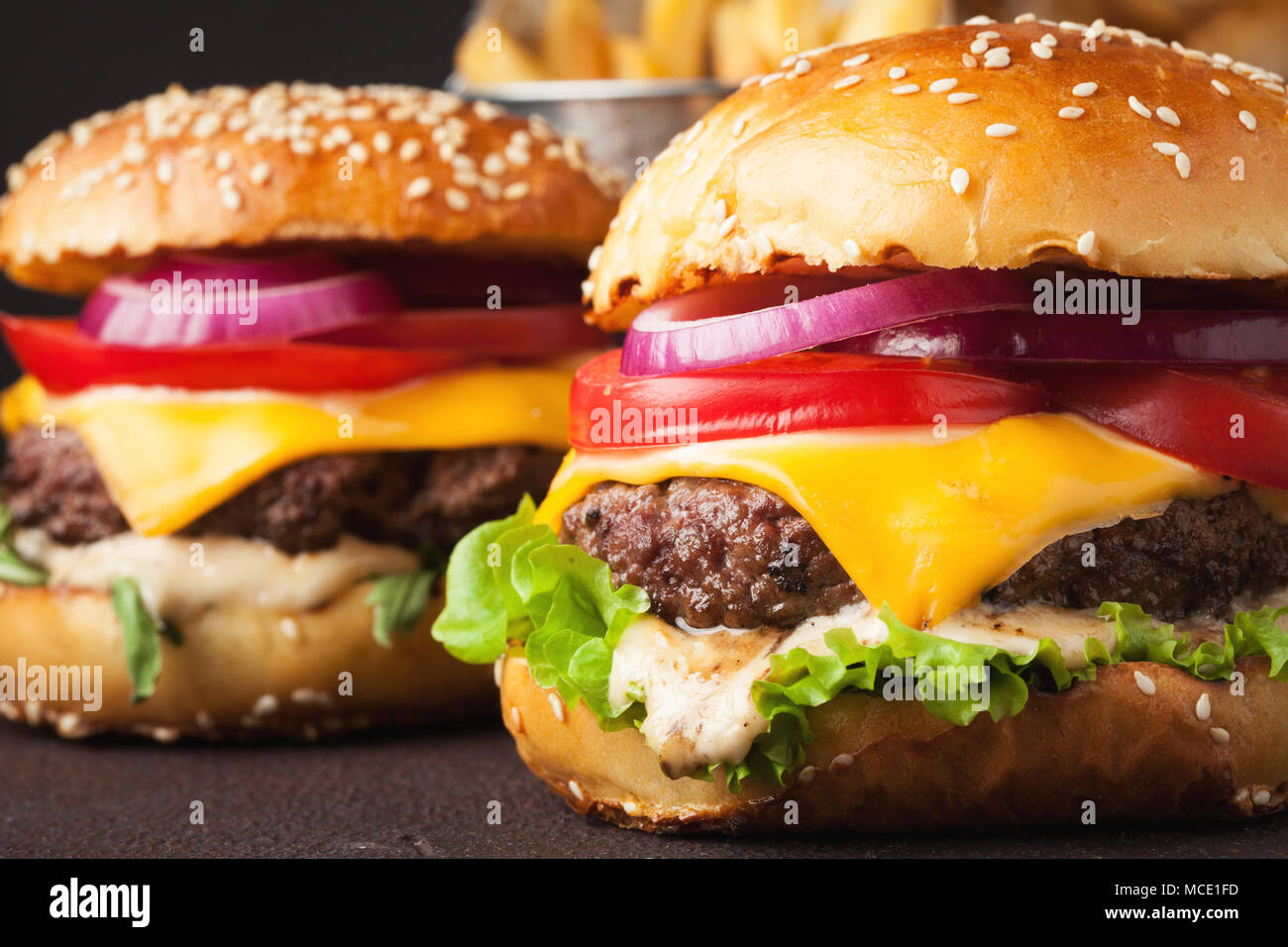 Close-up of delicious fresh home made burger with lettuce, cheese ...
