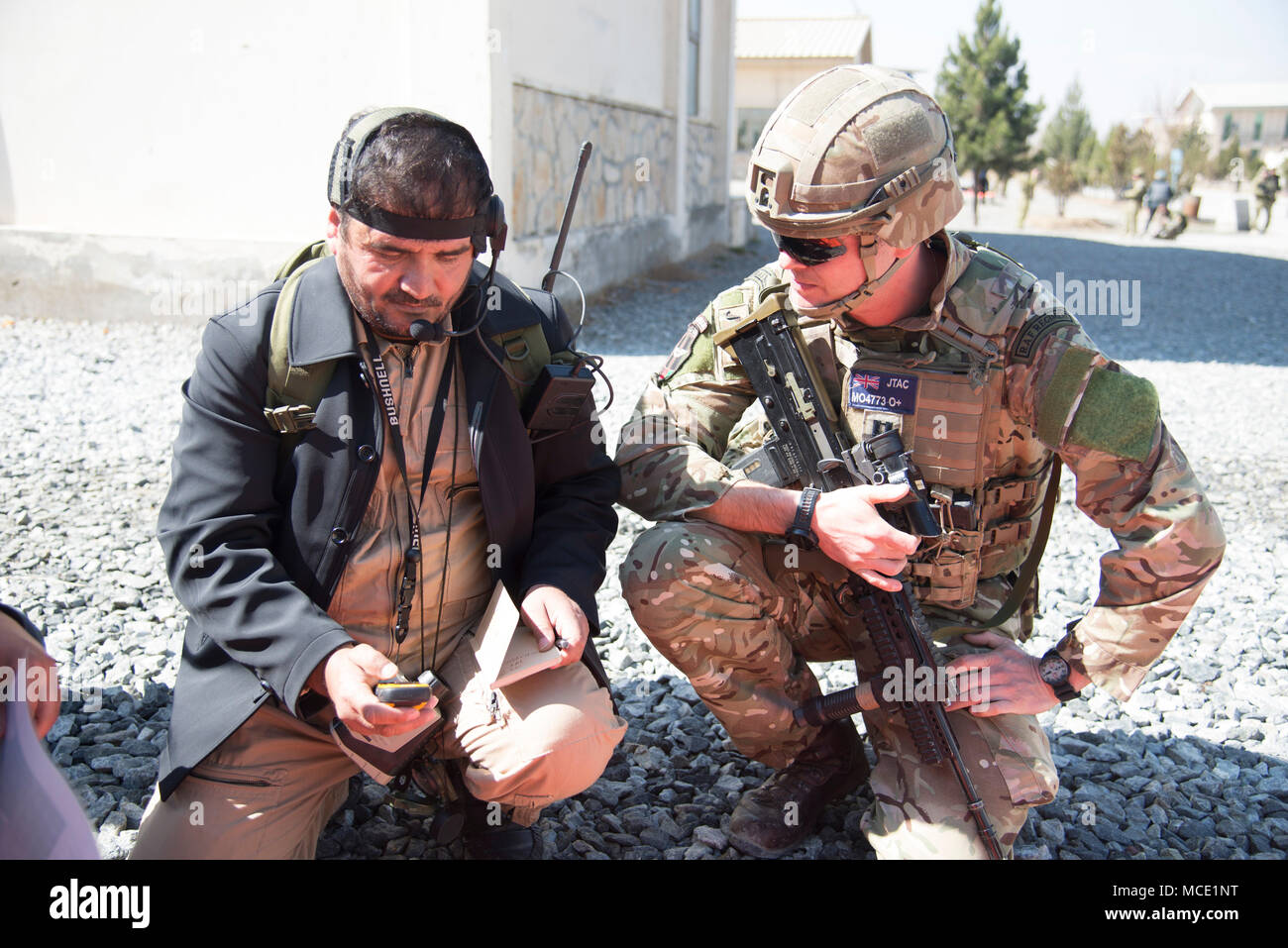 An Afghan tactical air coordinator relays coordinates during a training ...