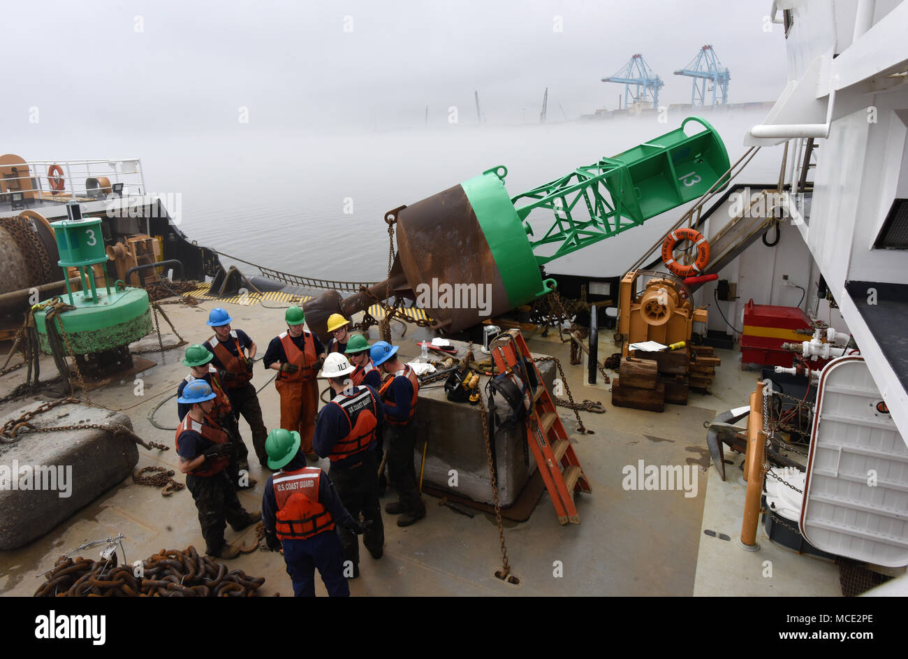 Crew members aboard Coast Guard Cutter Frank Drew discuss their plan of ...