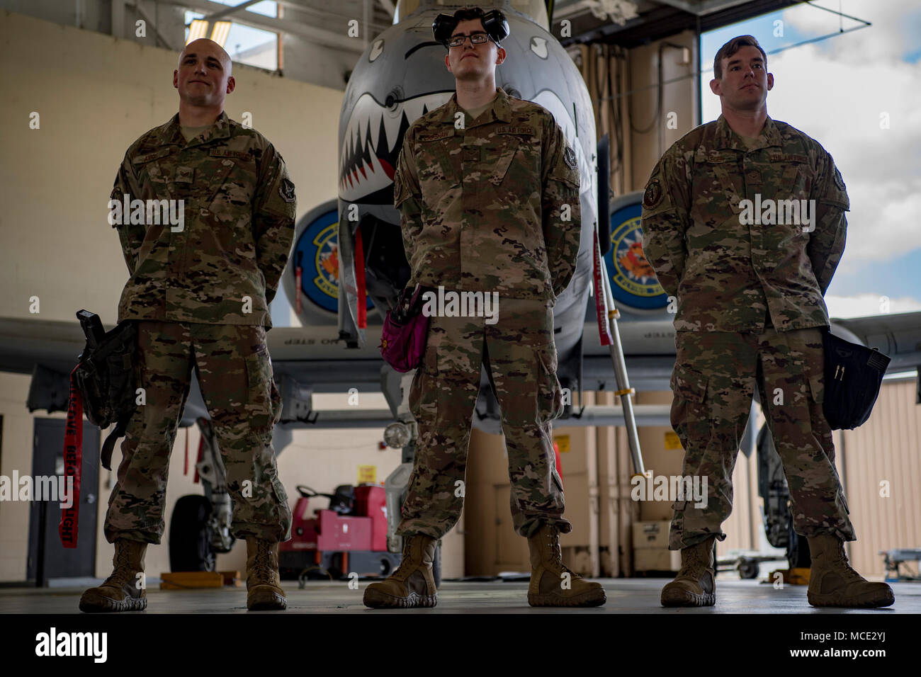 Staff Sgt. Ryan Amos, left, Airman 1st Class Joseph Capshaw, center ...