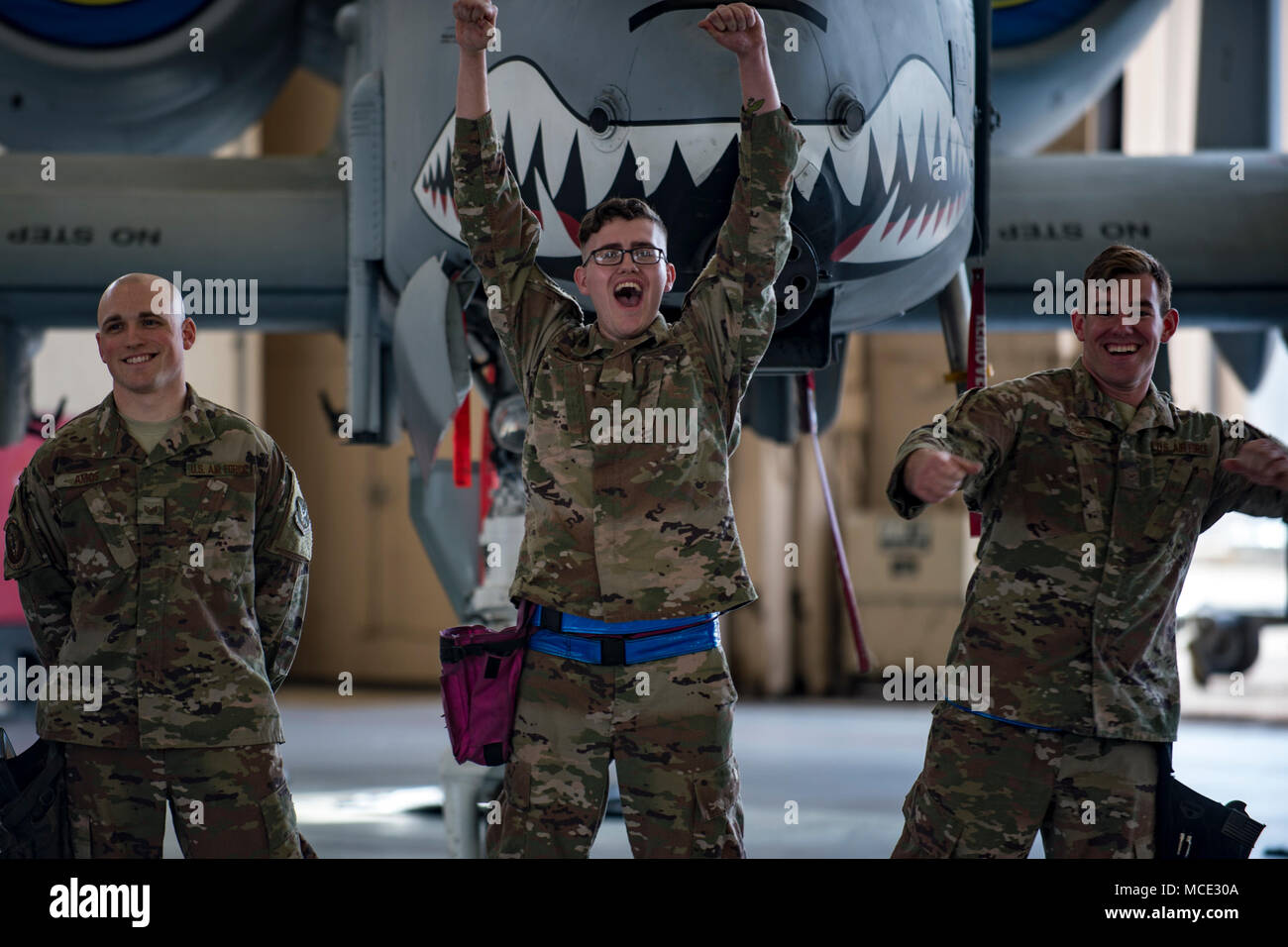 Staff Sgt. Ryan Amos, left, Airman 1st Class Joseph Capshaw, center ...