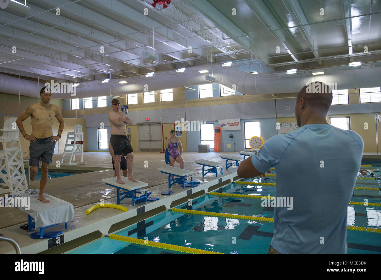 Atiba Wade (right), Team Army head swim coach, trains participants for ...