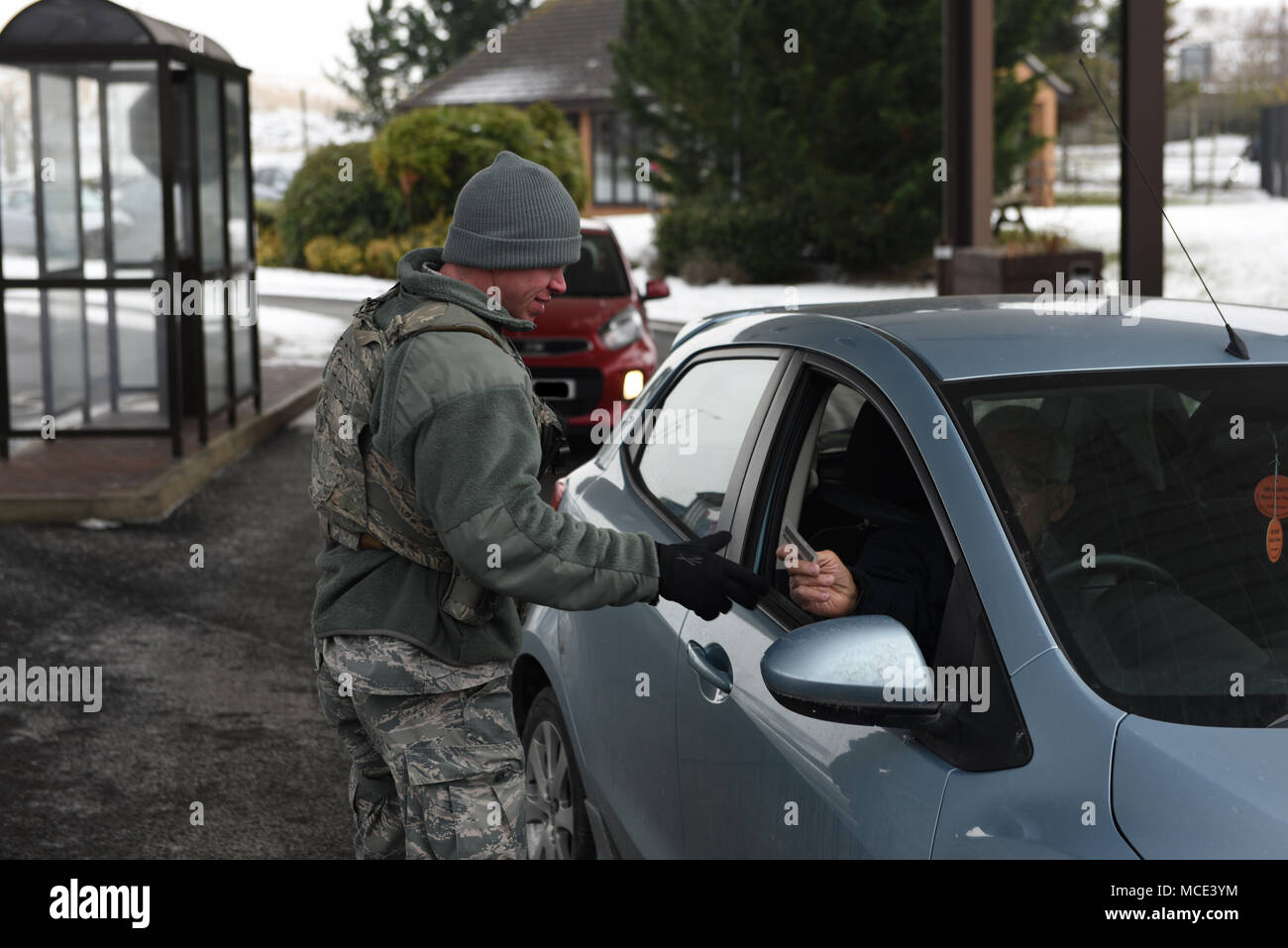 A Security Forces Airman from the 48th Security Forces Squadron checks ...