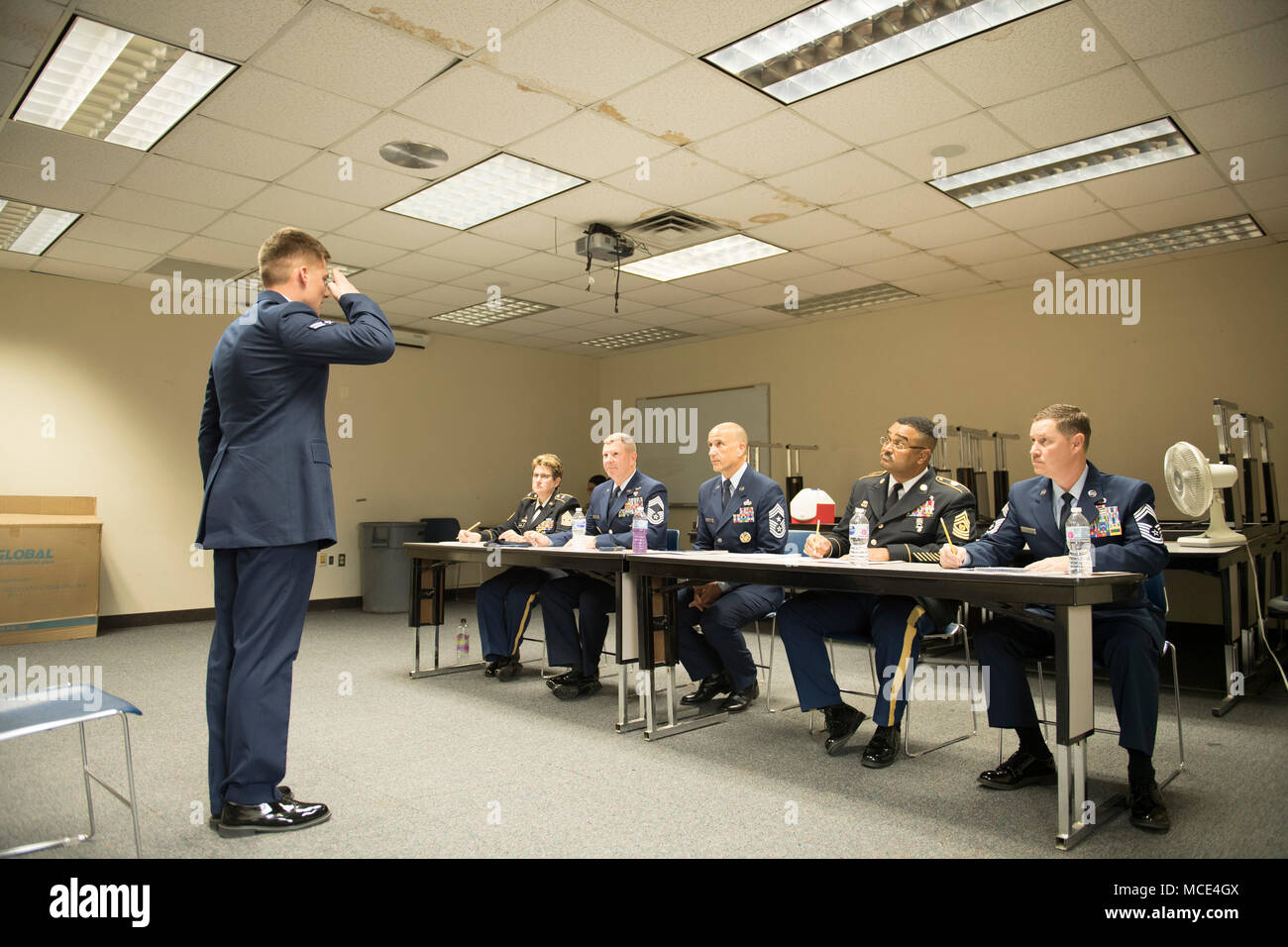 Airman 1st Class Kenan Whites reports to the board president for his ...