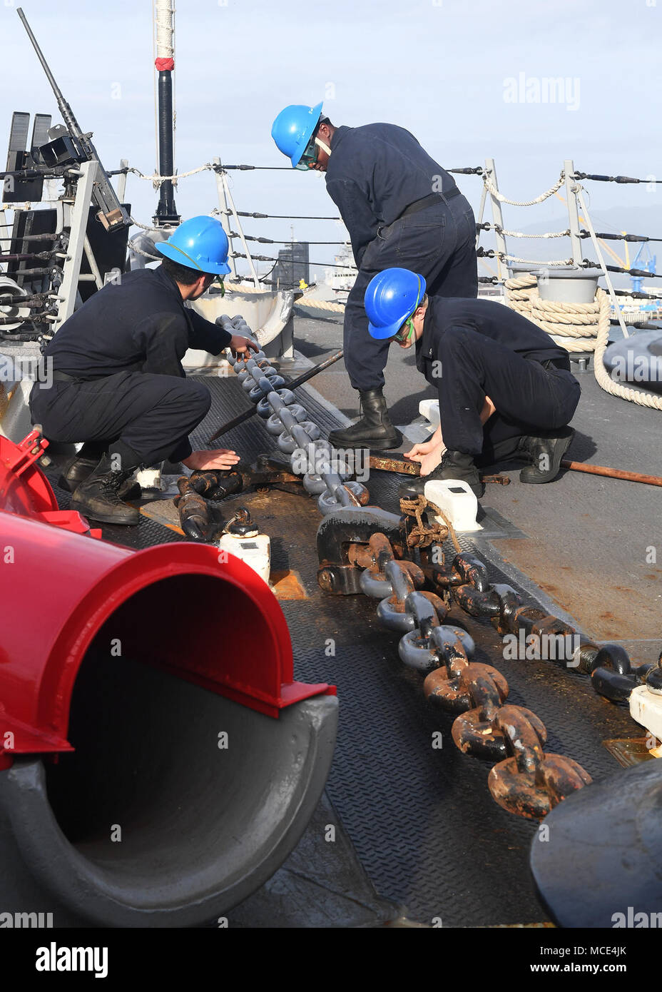 180227-N-FN963-0009 PACIFIC OCEAN (Feb. 27, 2018) Sailors place a chain ...