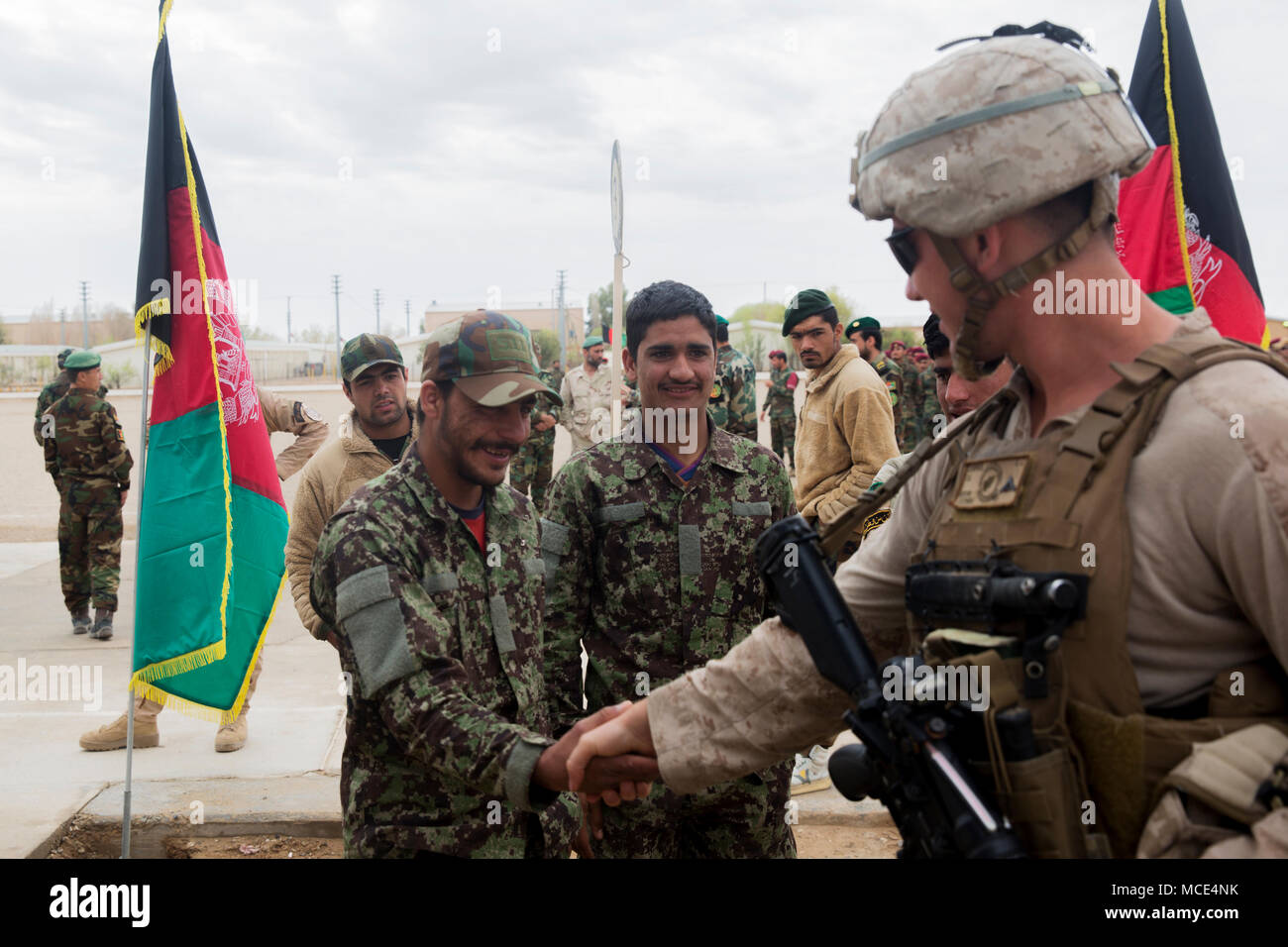 A Marine with Task Force Southwest exchanges greetings with soldiers of ...