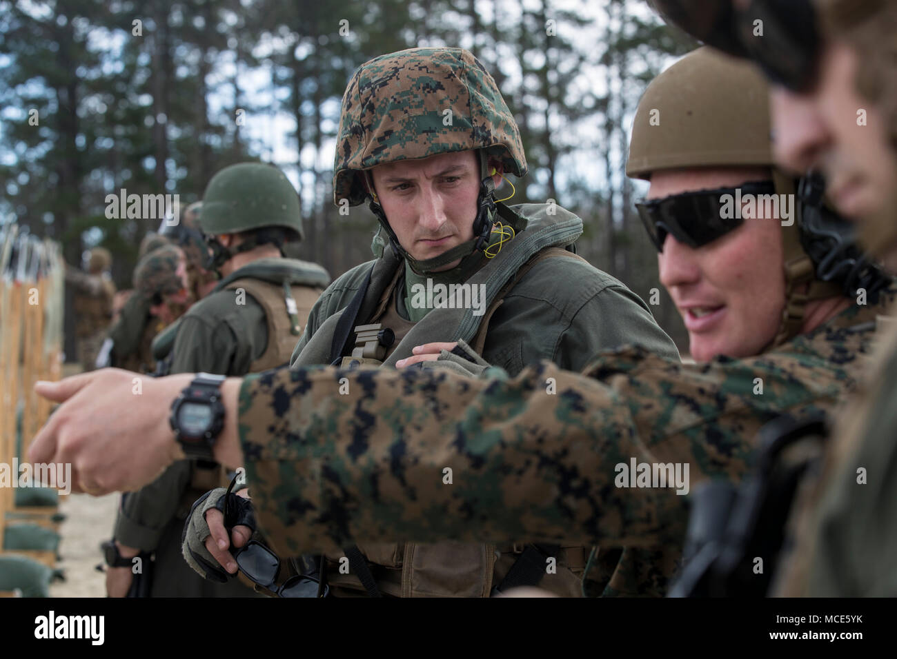 U.S. Marine Corps Capt. Justin R. Lovell receives instructions during ...