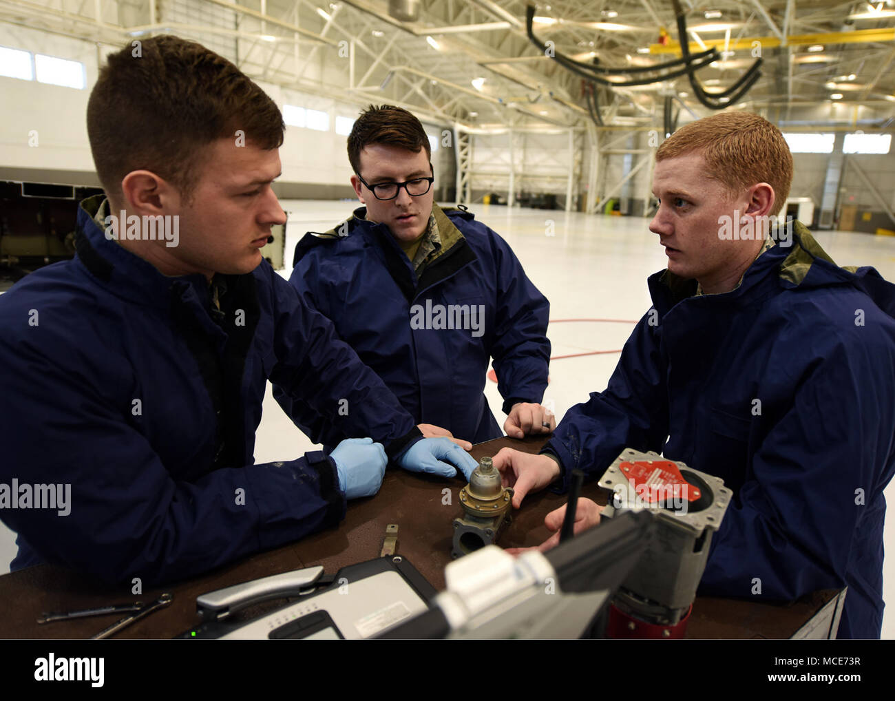 (From left) Airmen 1st class John Miller, Brian Figueroa-Orkwis, and ...