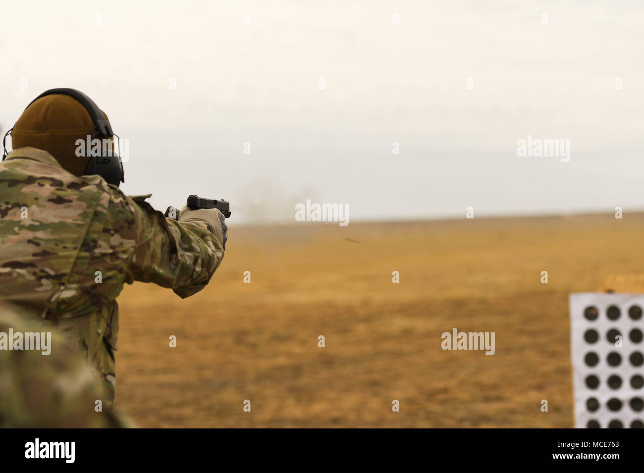 A U.S. Army Soldier shoots targets with his Glock 17 pistol, Feb. 27 ...