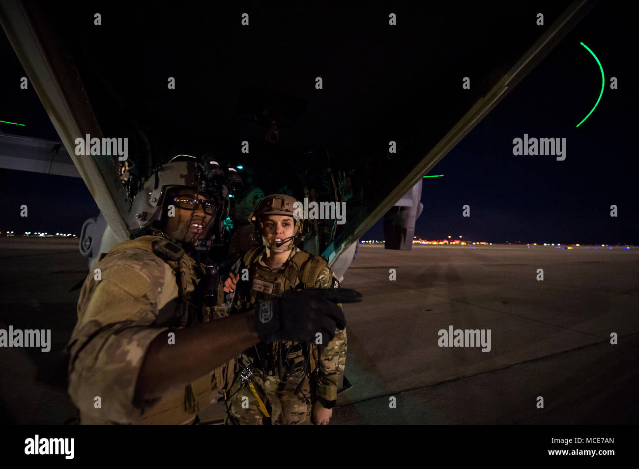 Tech. Sgt. Kelli Sampson, left, a CV-22 Osprey aerial gunner assigned ...