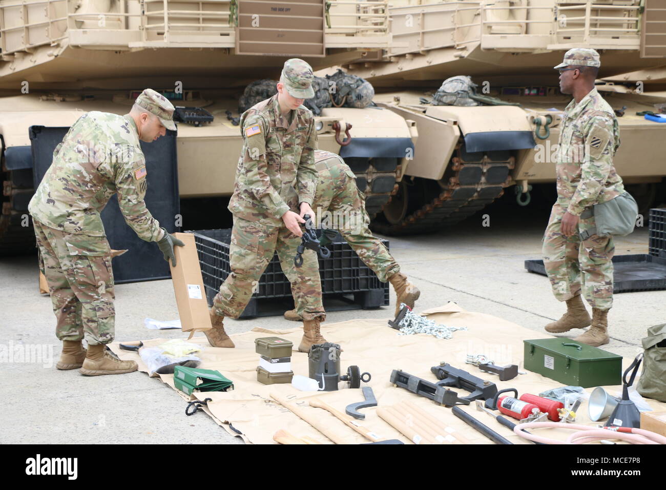 Pfc. Thomas Corter (center), an armor crewman with 3rd Combined Arms ...
