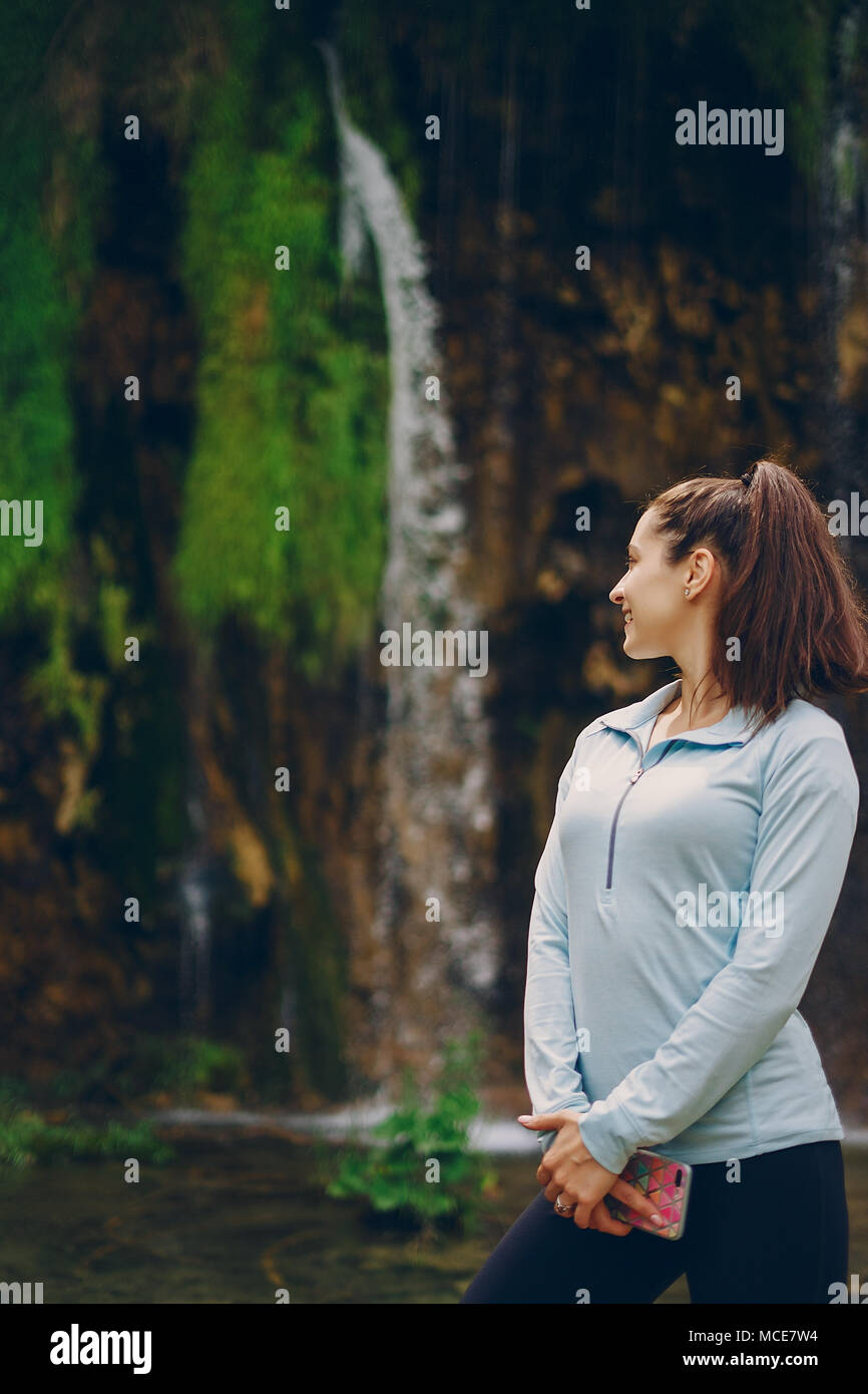 girl near the waterfall Stock Photo - Alamy