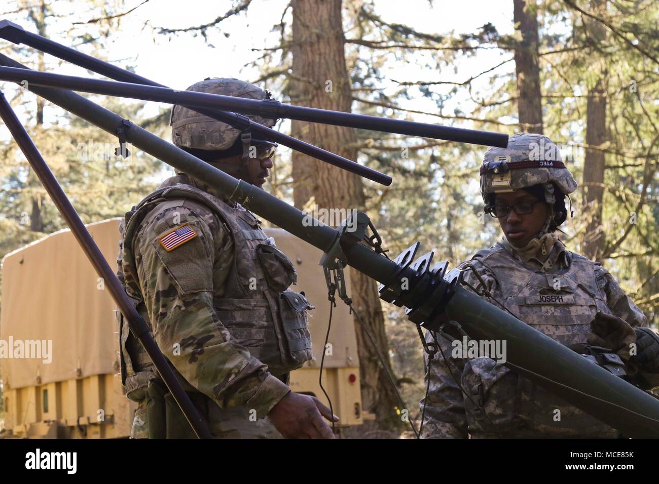 Spc. Lamont Gilbert and Spc. Krystina Joseph from 256 Signal Co., 308th ...