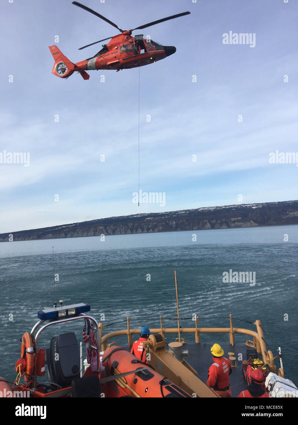 Coast Guard Cutter Naushon (WPB 1311) and crew conduct hoist training ...