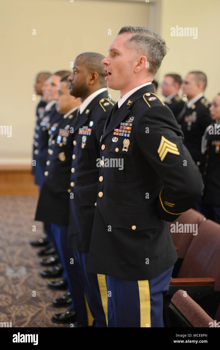 Sgt. Brendan Neuman, combat medic, sings the Army Song alongside his ...