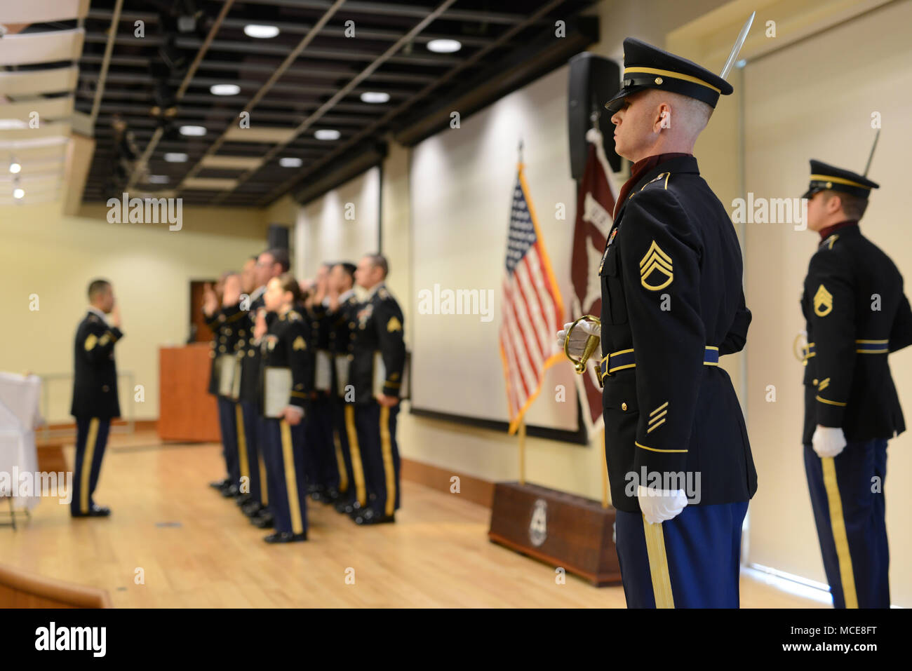 The unit honor guard stands at attention during the Evans Army ...