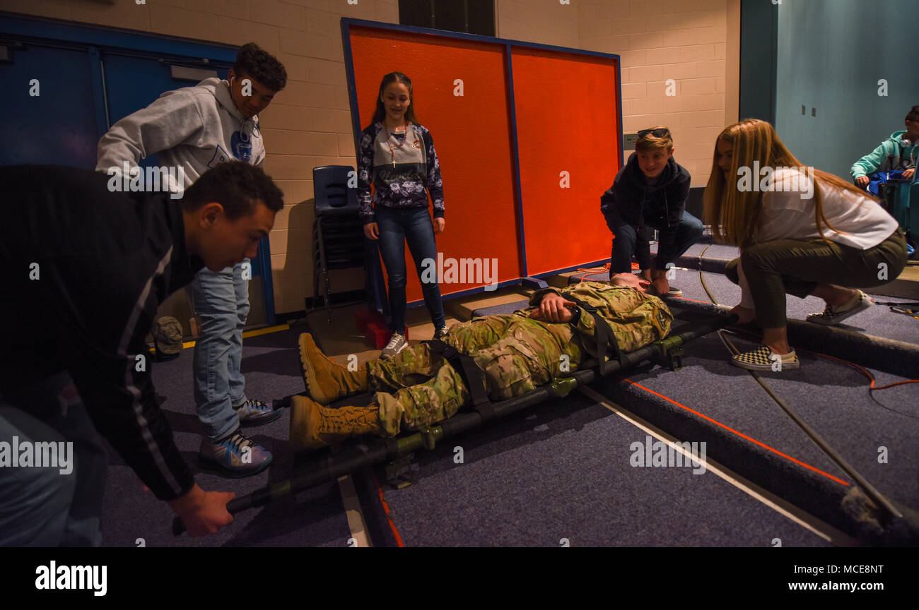 Students from Buena High School use a collapsible handle litter to lift ...