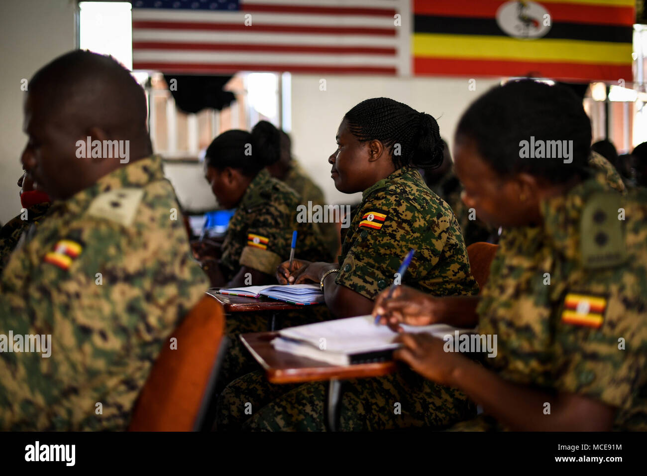 Ugandan People's Defense Force soldiers listen during the Civil ...