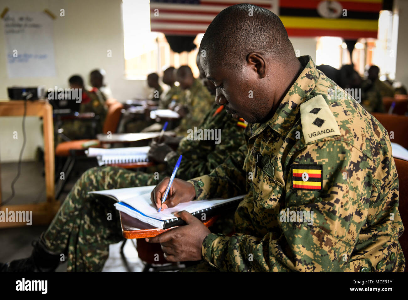 Ugandan People's Defense Force soldiers take notes during the Civil ...