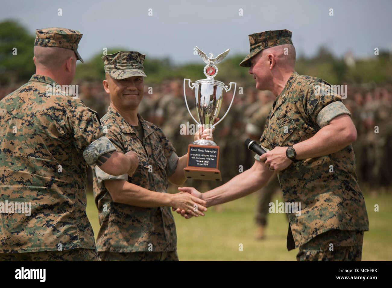 Brig. Gen. Daniel Conley, right, presents a trophy to Lt. Col ...
