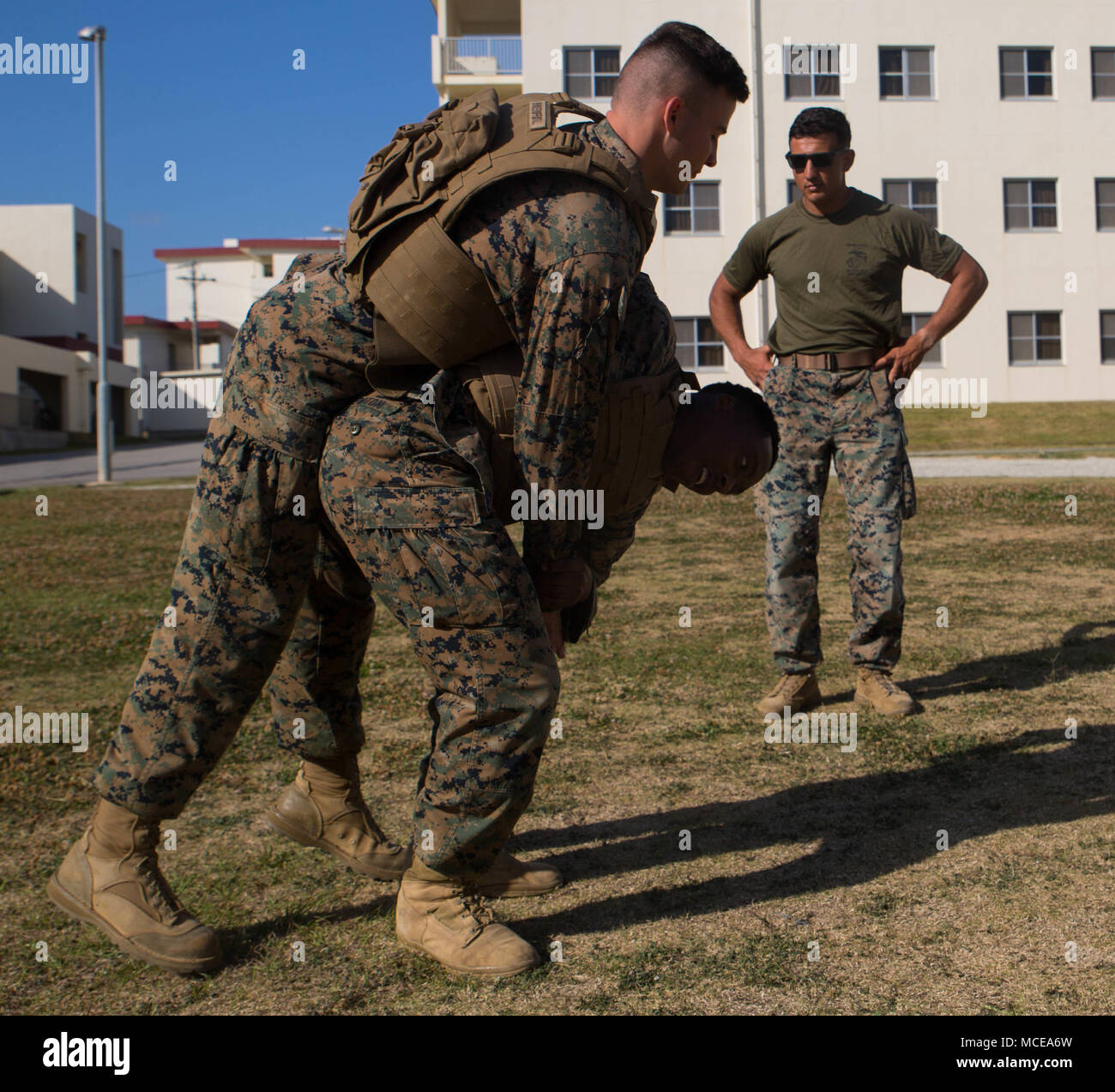 Lance Cpl. Jordan Brewton performs a hip toss technique during Marine ...
