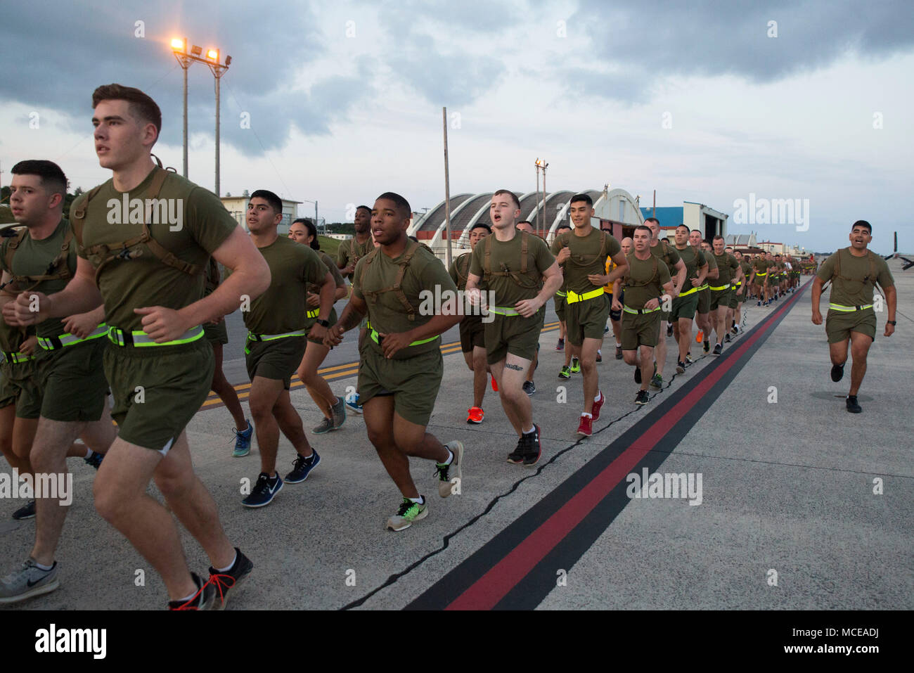 Marines with 1st Marine Aircraft Wing participate in a motivational run ...
