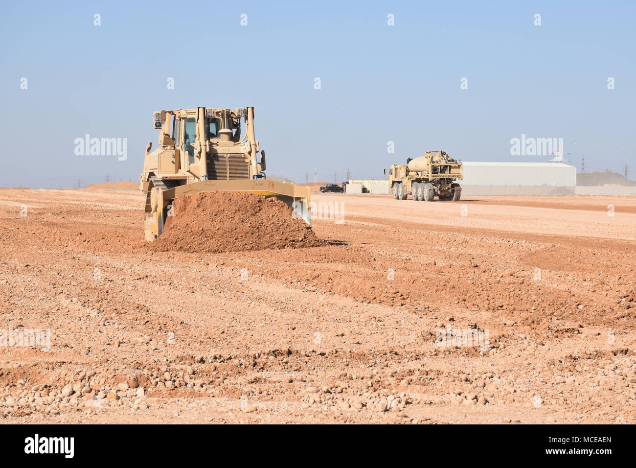 IRAQ — Spc. Justin Ernst uses a bulldozer Feb. 9, 2018 to spread ...