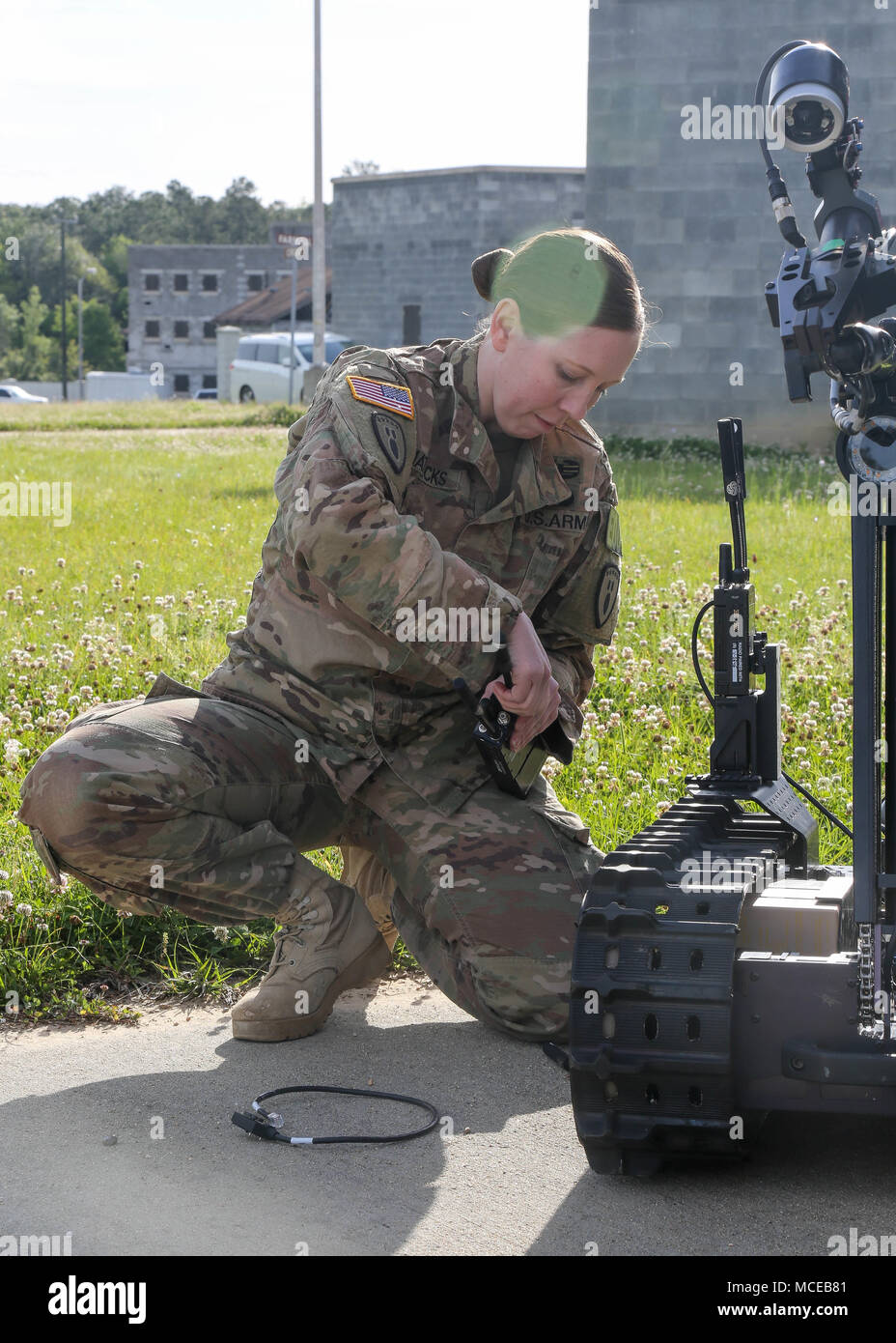 U.S. Army Cpl. Rebecca Mattocks, 663D Ordnance Company EOD, 242D Ordnance Battalion EOD, sets up ...