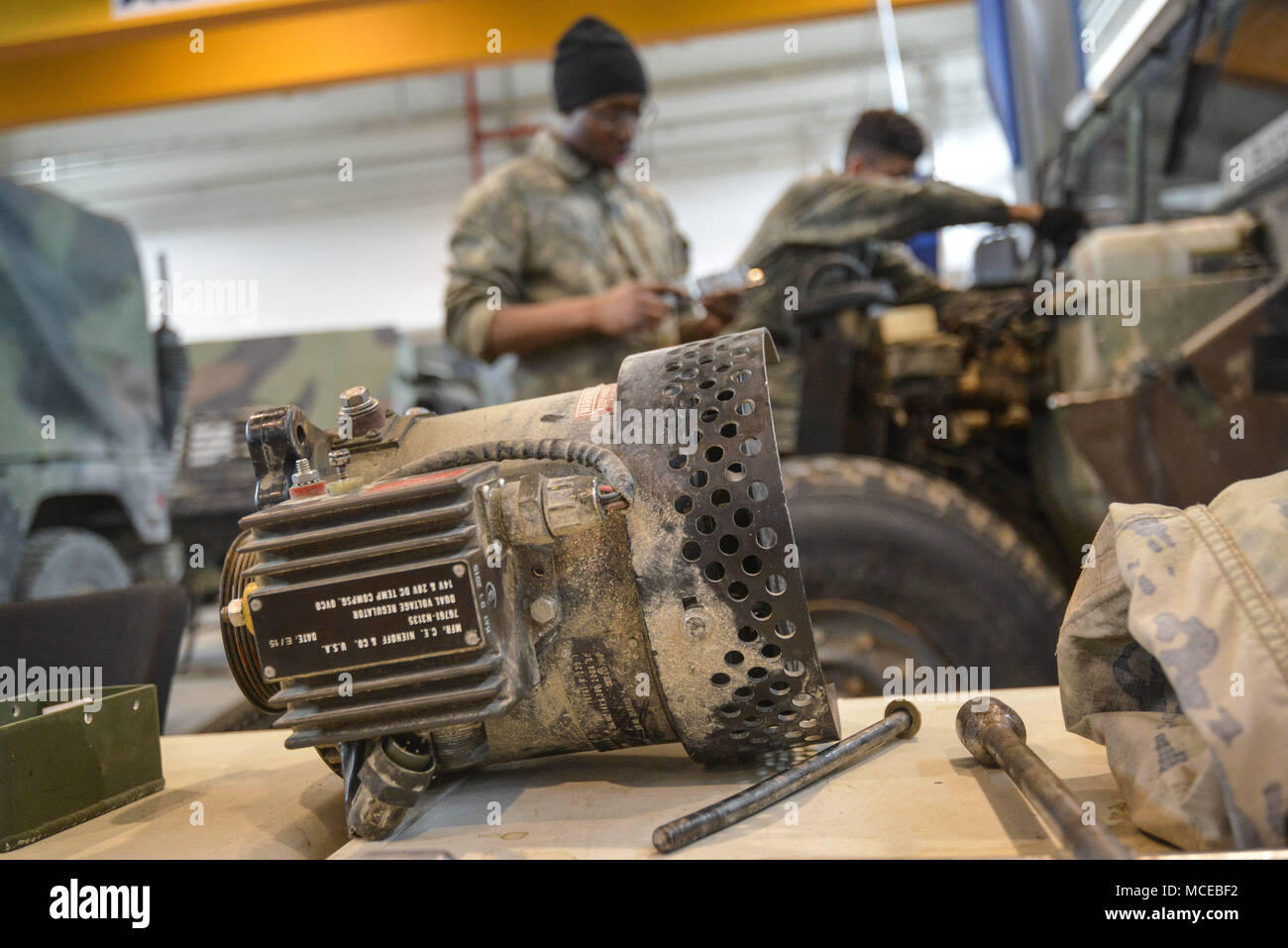 The photo shows a dismounted High Mobility Multipurpose Wheeled Vehicle ...