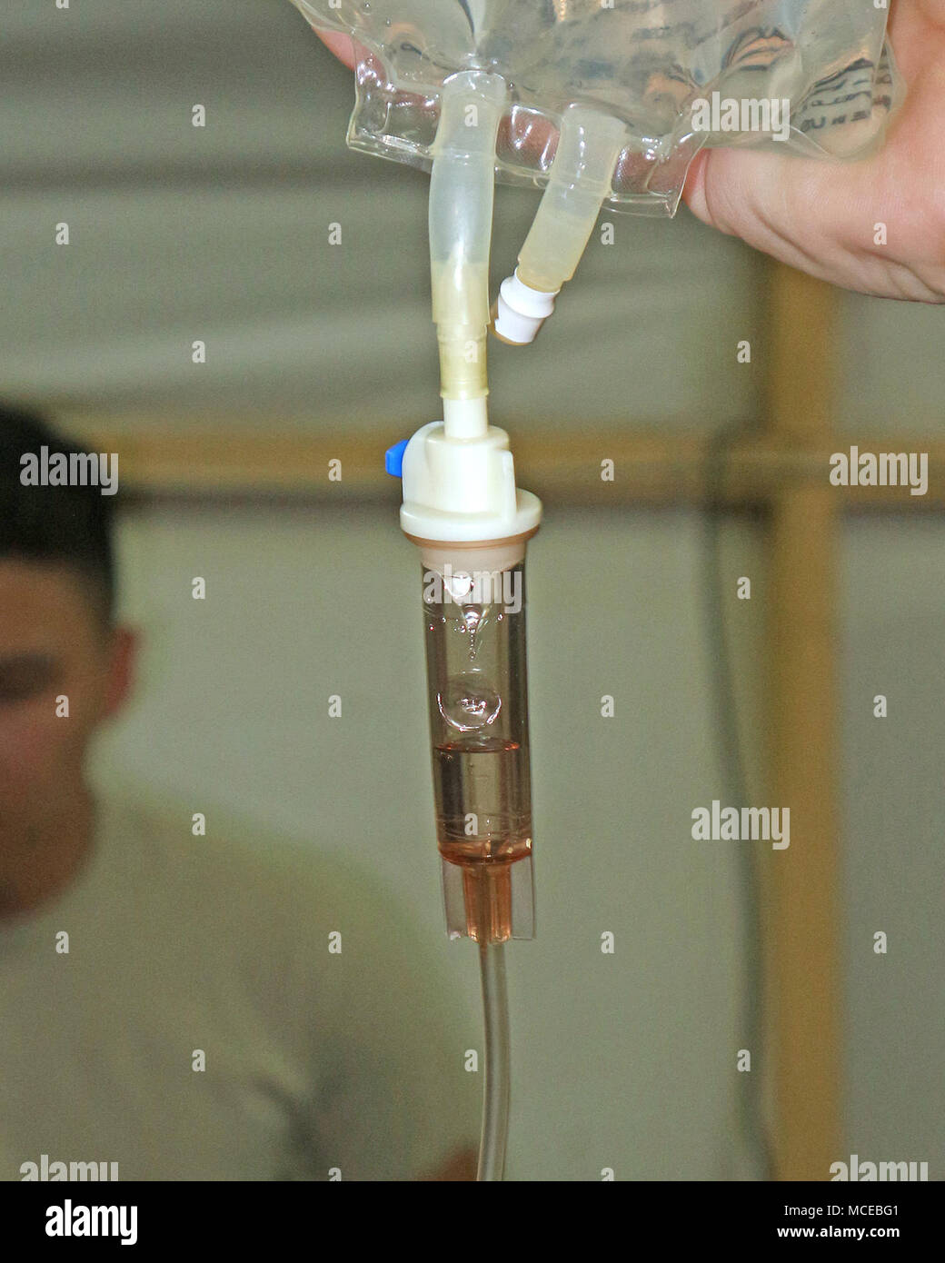 An I.V. drip is started as Medics with the Indiana National Guard’s ...
