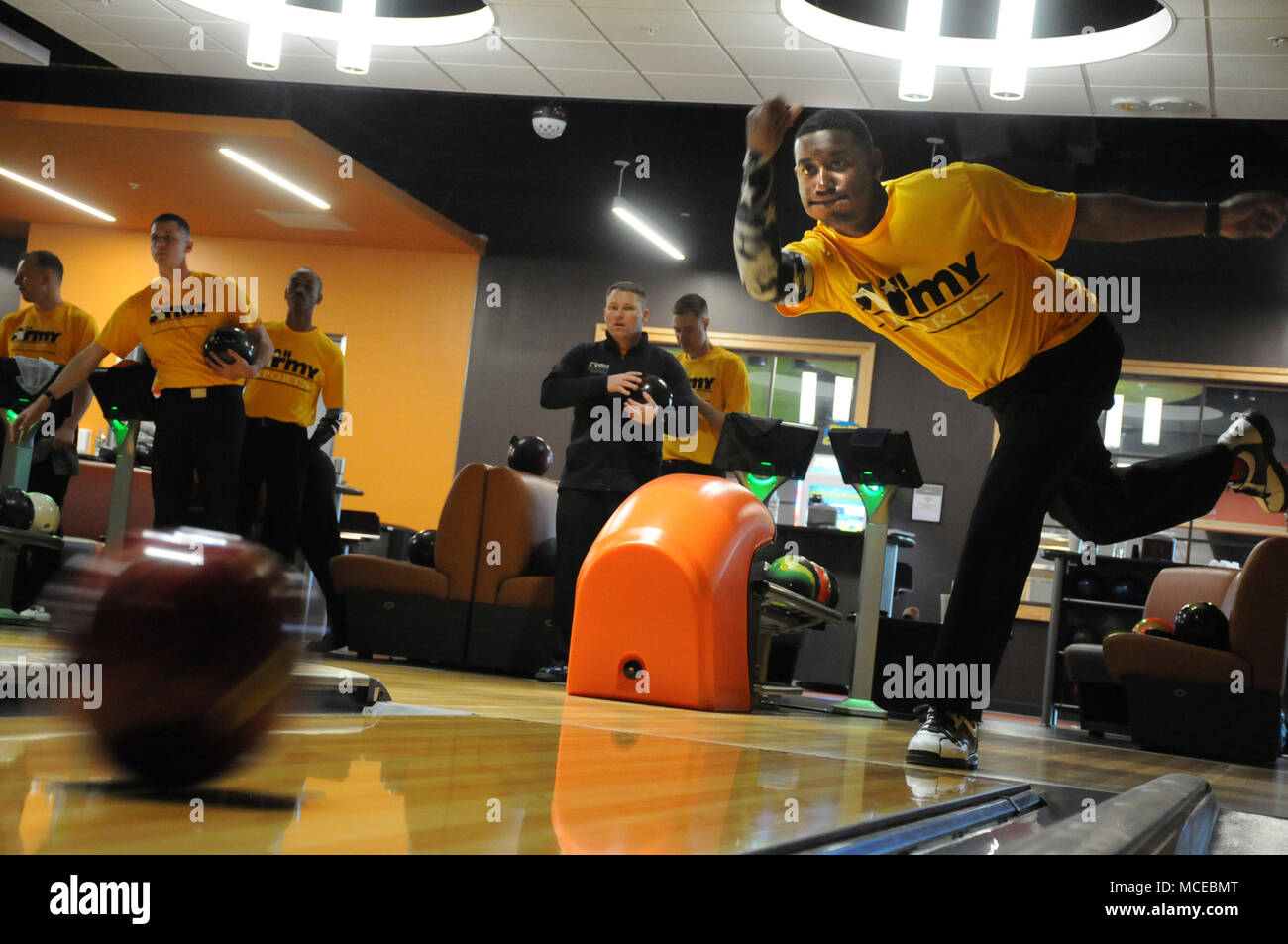 Sgt. Gavin E. Wainright Jr., from Fort Hood, Texas, launches the ball ...
