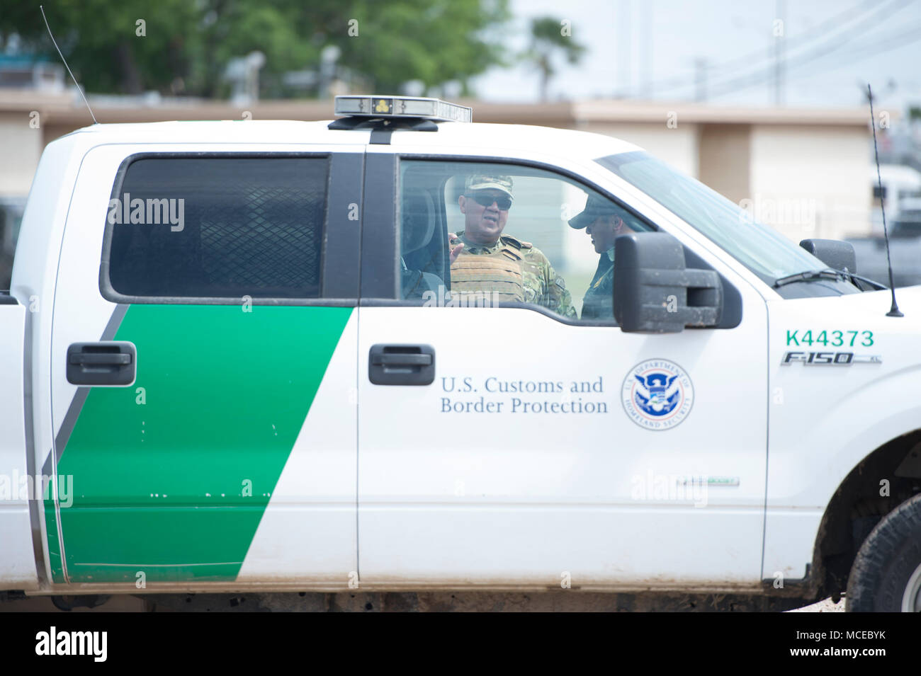 A Texas Guardsmen and a Customs and Border Patrol agent discuss the lay ...