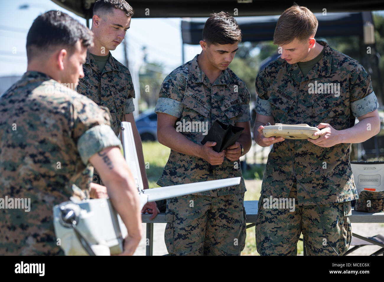 U.S. Marines learn how to inspect the functionality of an RQ-20 Puma ...