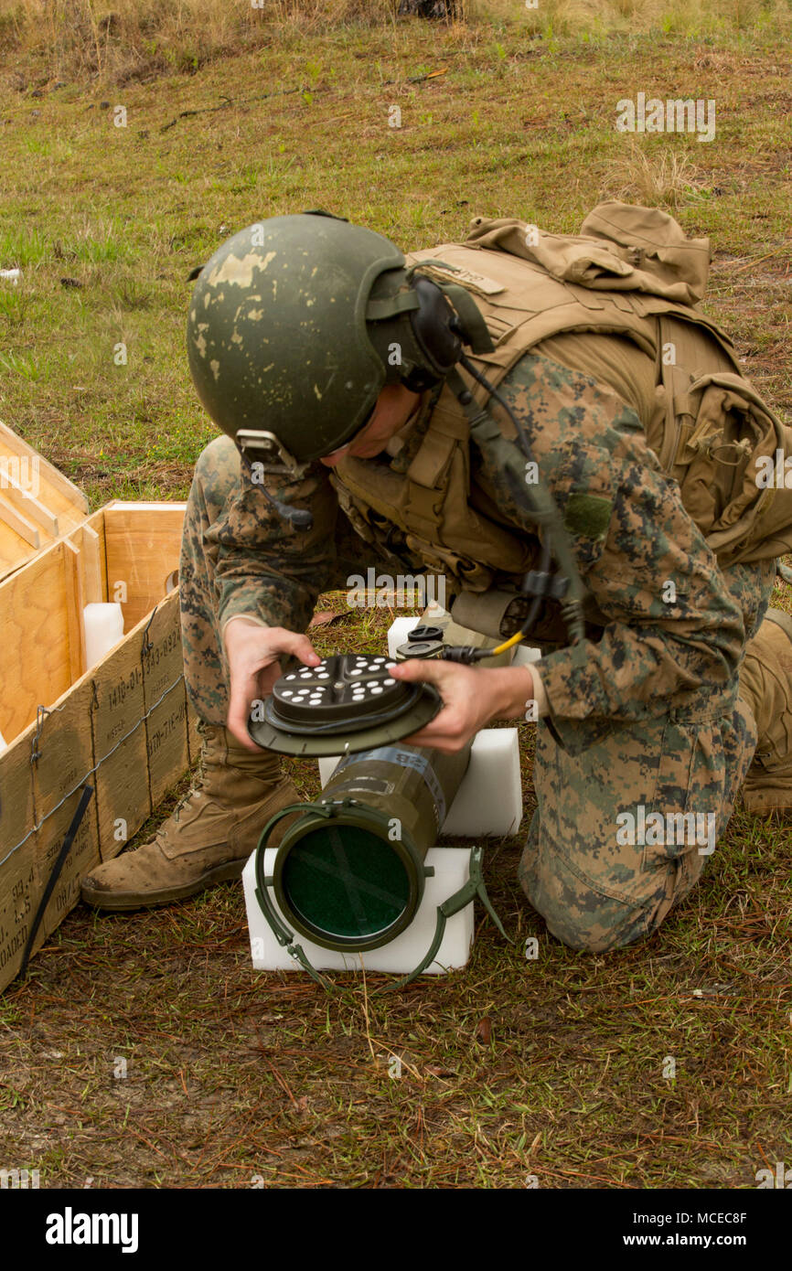 A U.S. Marine with 2nd Light Armored Reconnaissance Battalion inspects ...
