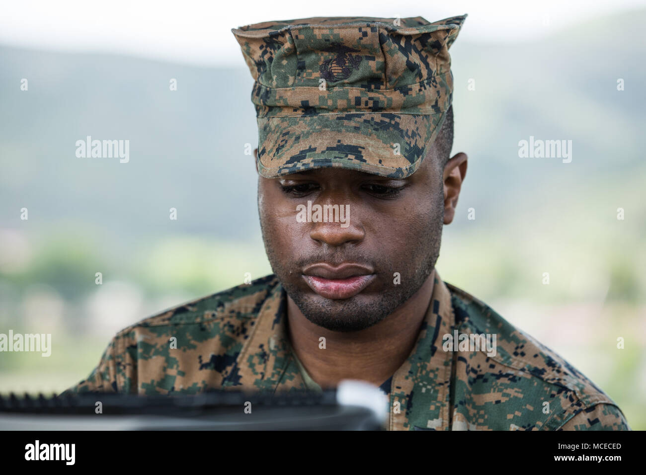 U. S. Marine Corps Cpl. Gregory Austin, an intelligence analyst with ...