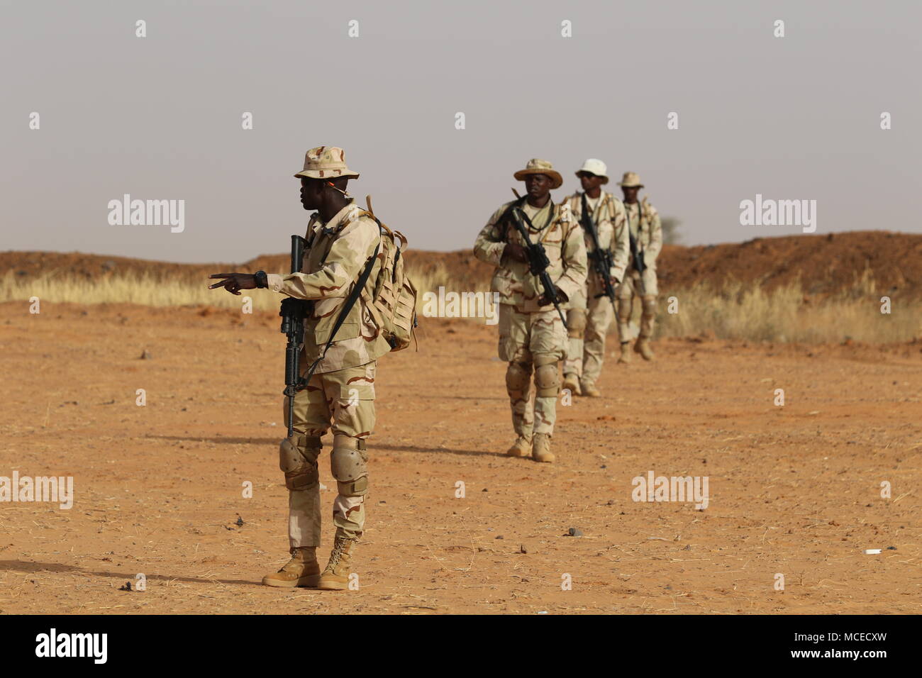 Senegalese soldiers practice hand signals in a small unit tactics class ...
