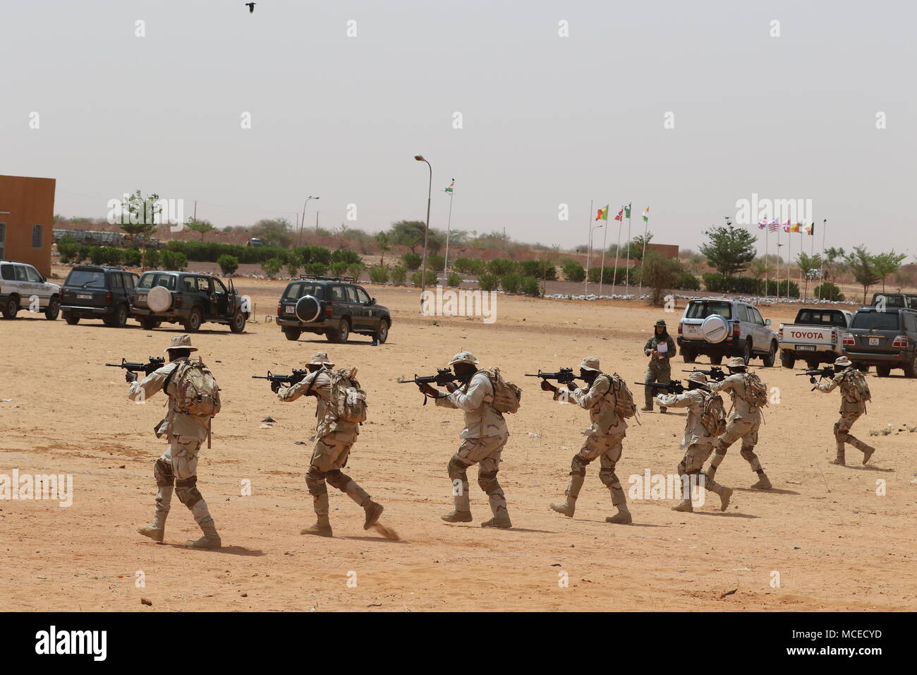 A squad of Senegalese soldiers assaults the objective in a small unit ...