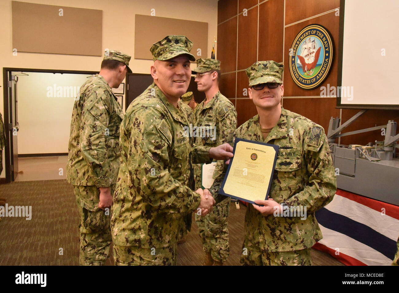 YN1 Kloos receives a letter of recommendation at All Hands on 13 April ...