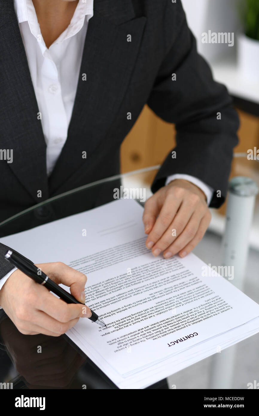 Close-up of female hands with pen over document, business concept Stock ...