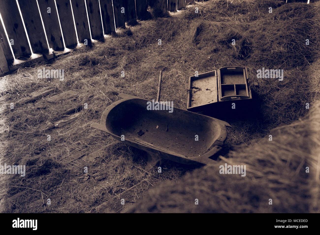 Vintage wooden objects in abandoned barn. Traditional tools in a shed ...