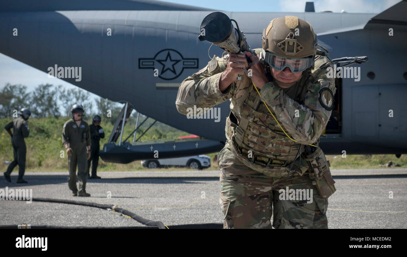 An Airman assigned to the 36th Mobility Response Squadron carries a ...