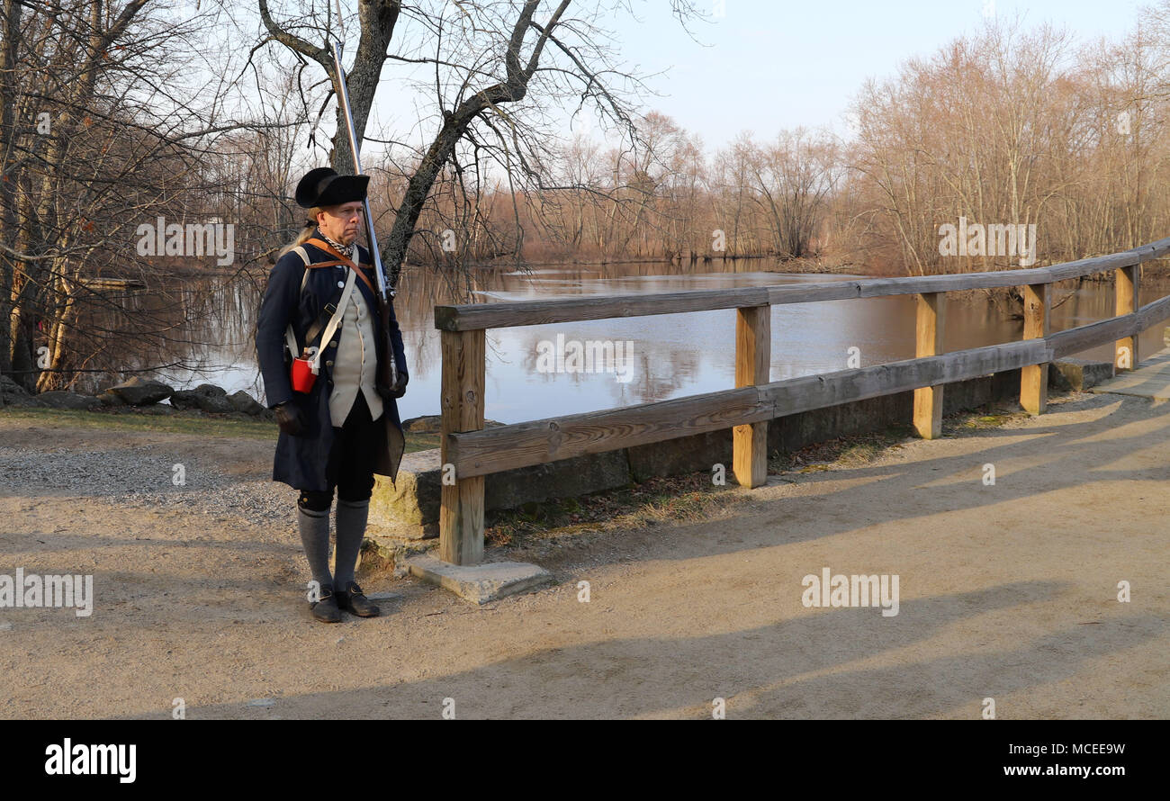 CONCORD, Mass.-- War reenactor guards the Old North Bridge during the ...