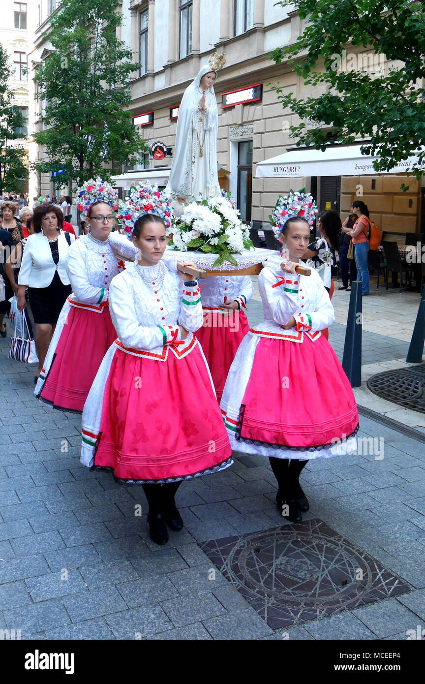 Girls parade with an effigy of Virgin Mary during the St Stephen’s Day ...