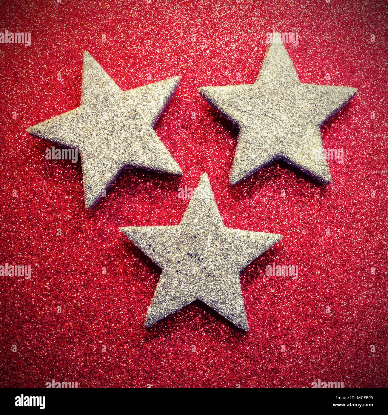 large silver stars on red illuminated background Stock Photo - Alamy