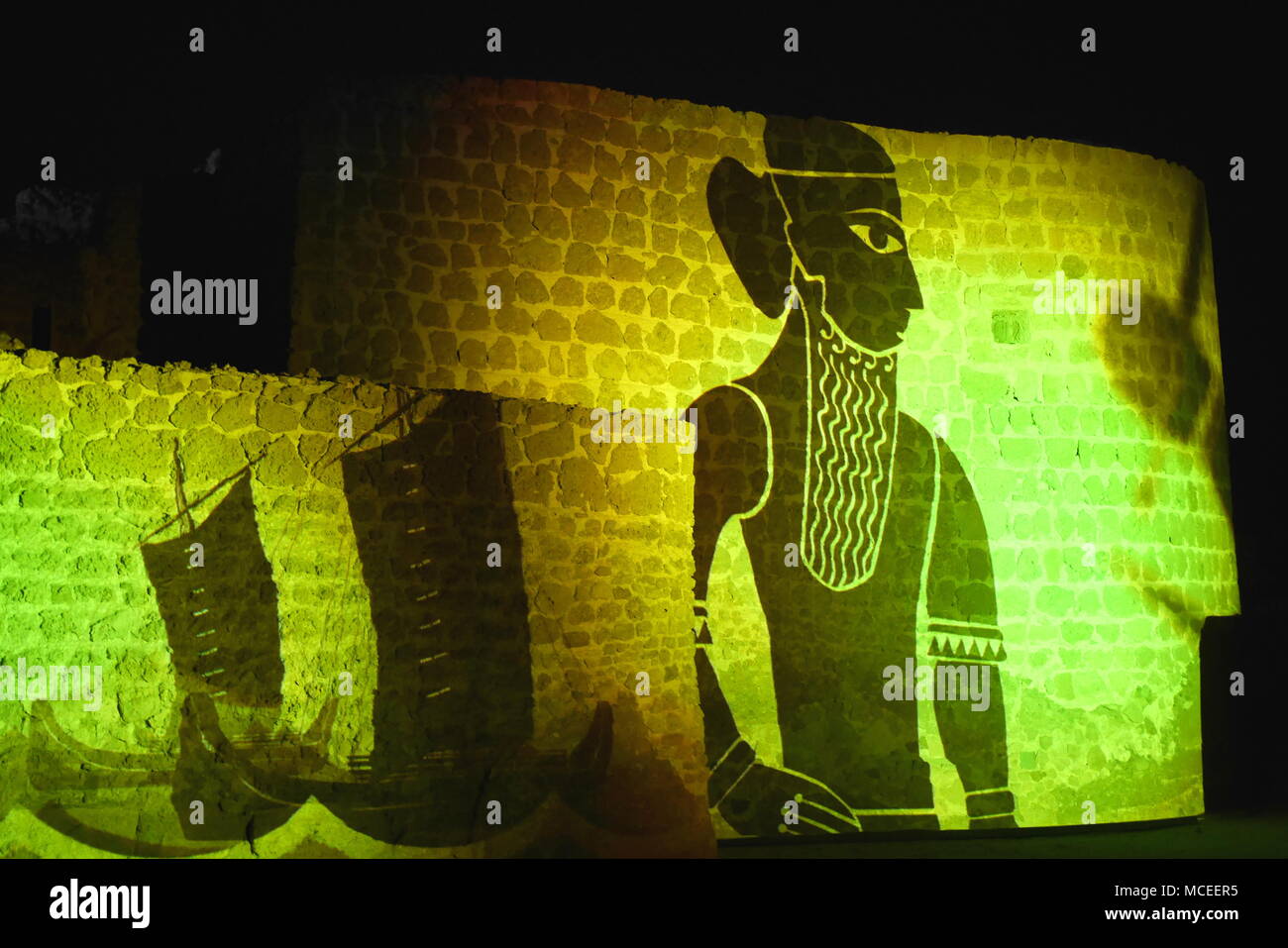 Light show at the Bahrain Fort, Portuguese Fort, depicting scenes from ...