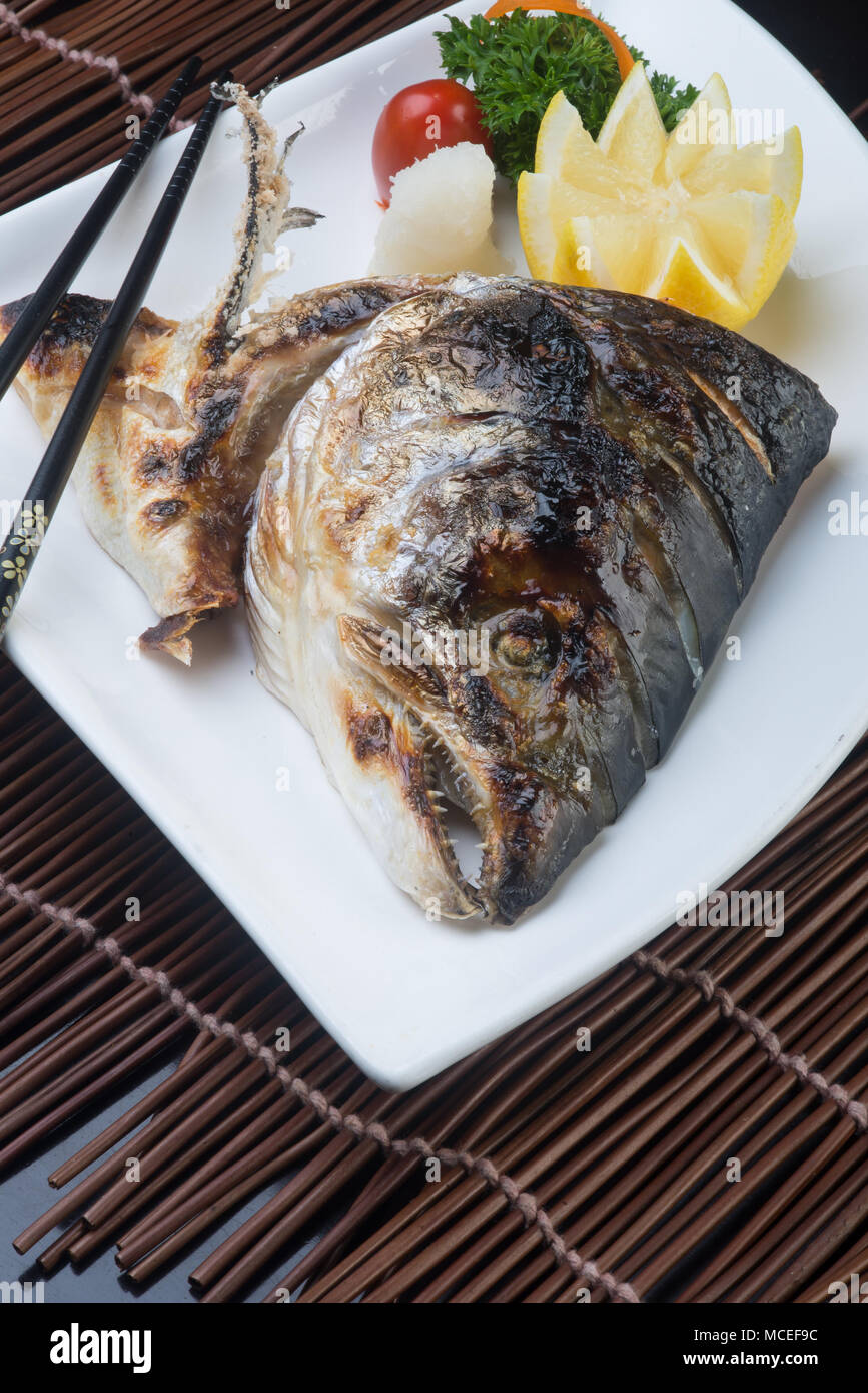 japanese cuisine. fried fish head on background Stock Photo - Alamy